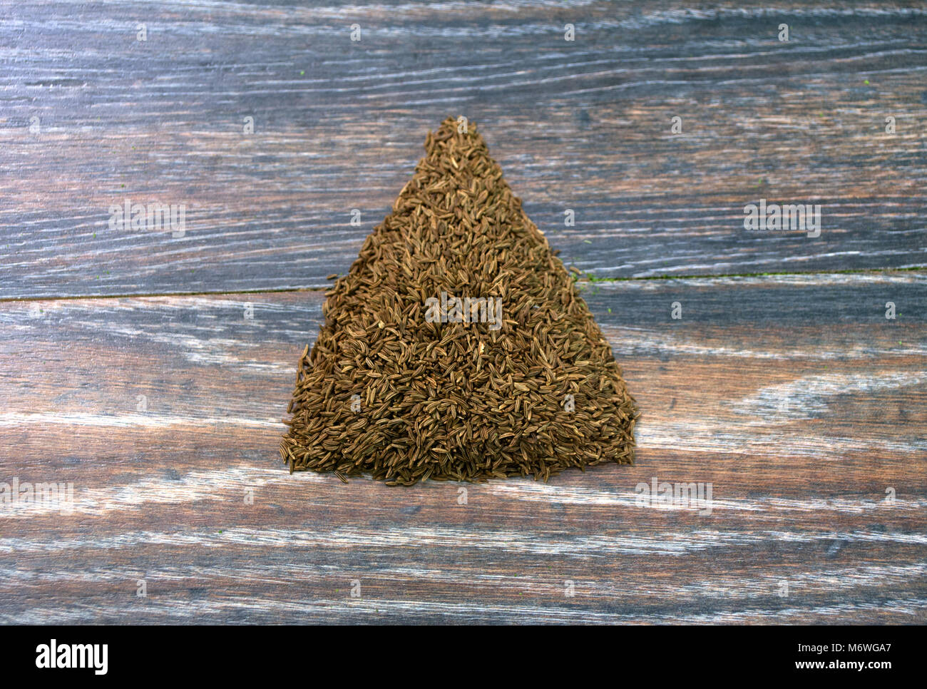 Various forms of carum carvi on a wooden background Stock Photo - Alamy
