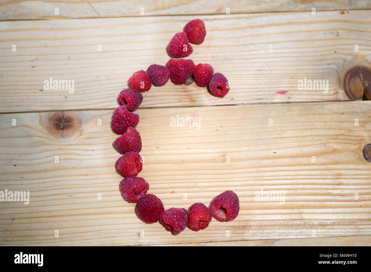 Alphabetical letters made of raspberries on a white background Stock ...