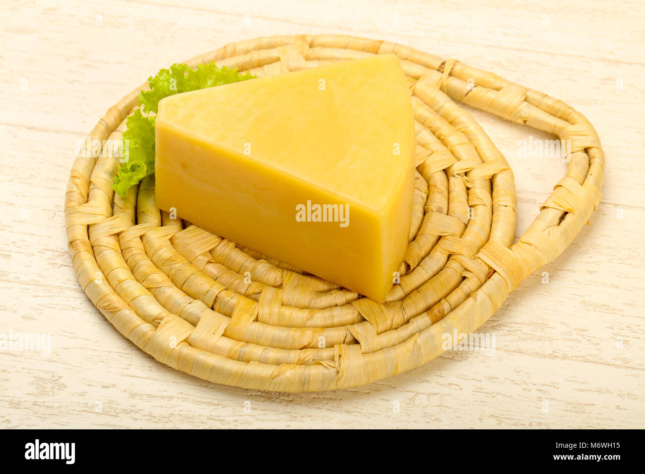 Parmesan cheese triangle Stock Photo - Alamy