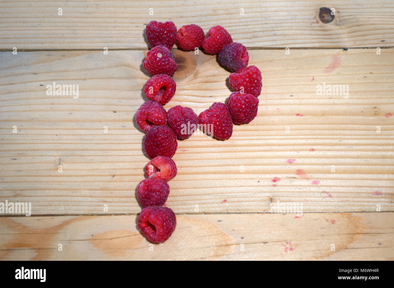 Alphabetical letters made of raspberries on a white background Stock ...