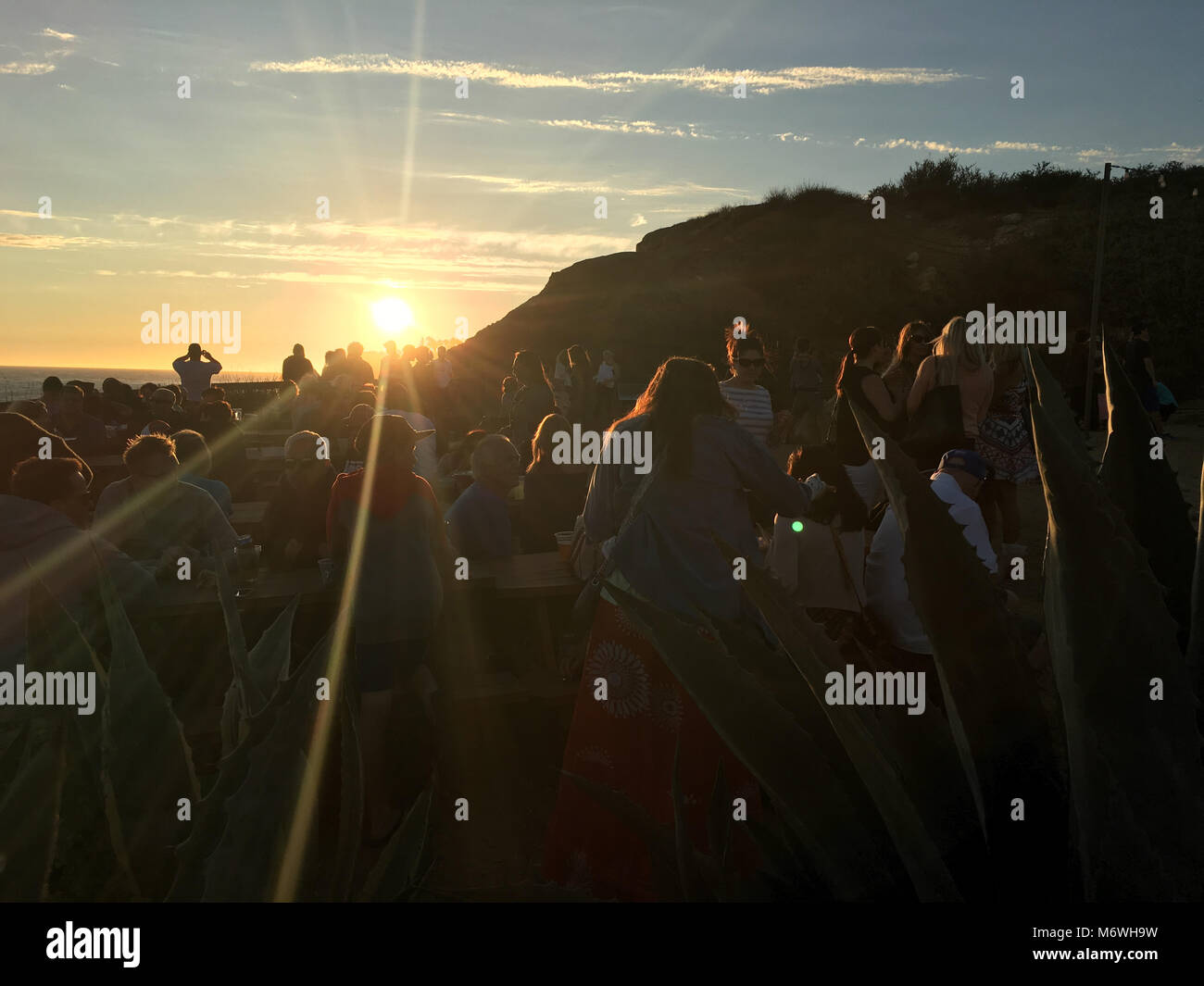 People gathered for drinks at sunset on the terrace at Terranea Resort ...