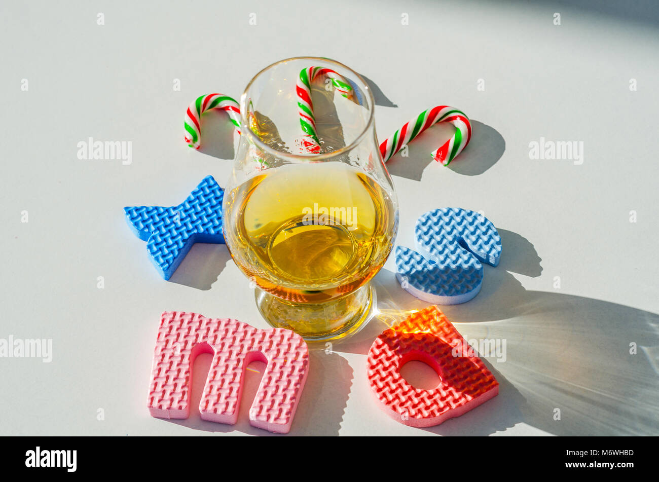 single malt whisky in the glass with rubber letters, xmas inscription ...