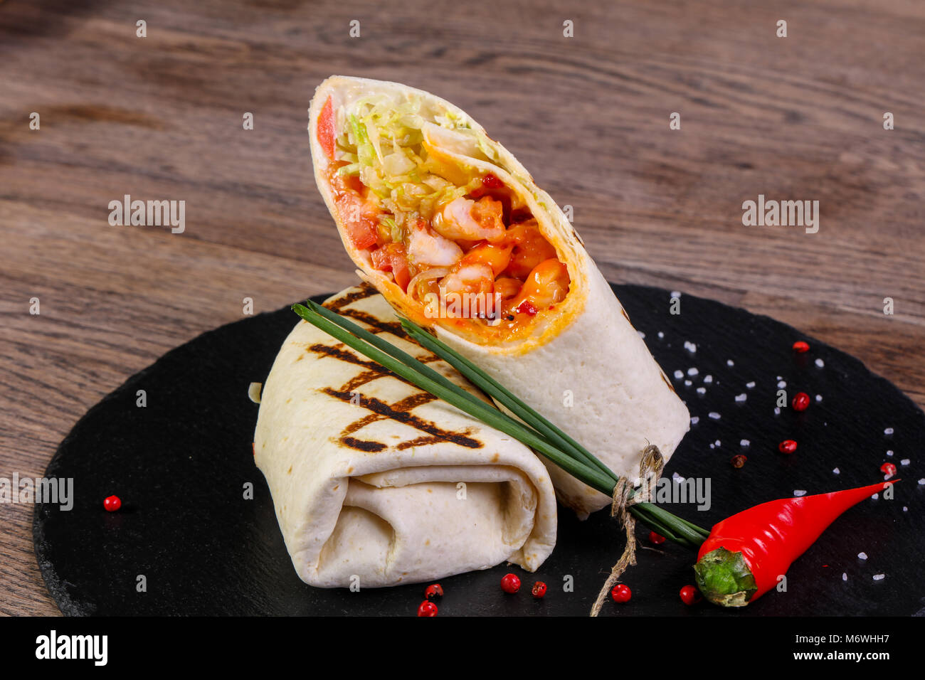 Chicken roll with tortilla served pepper Stock Photo - Alamy