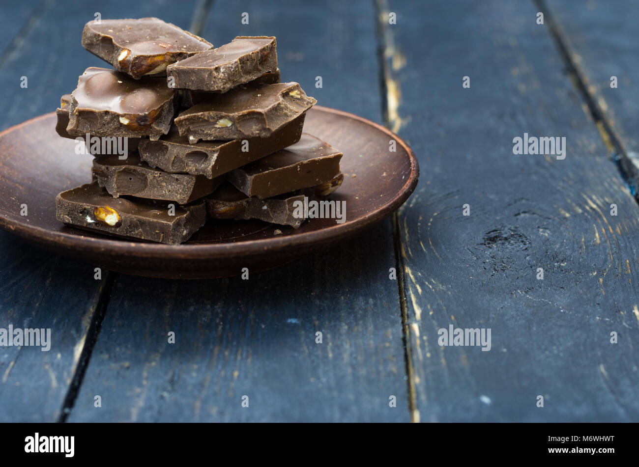 Chocolate lined with a slide on a plate. Brown chocolate on a brown ...