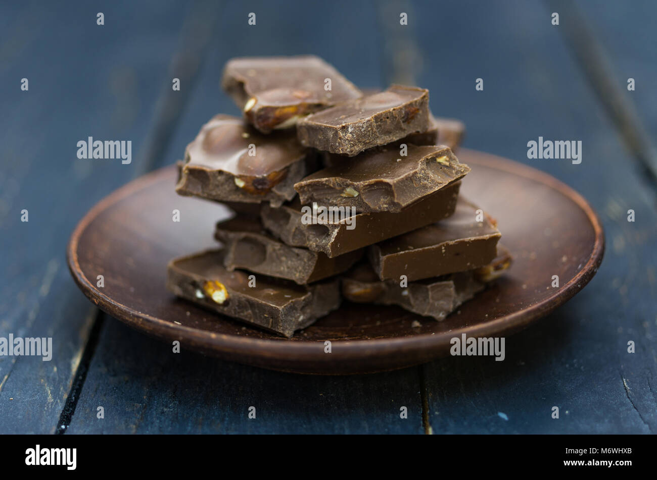 A plate of chocolate in the center of the table. Front view Stock Photo ...