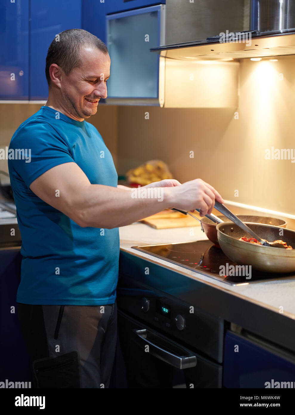 Man frying chicken hi-res stock photography and images - Alamy