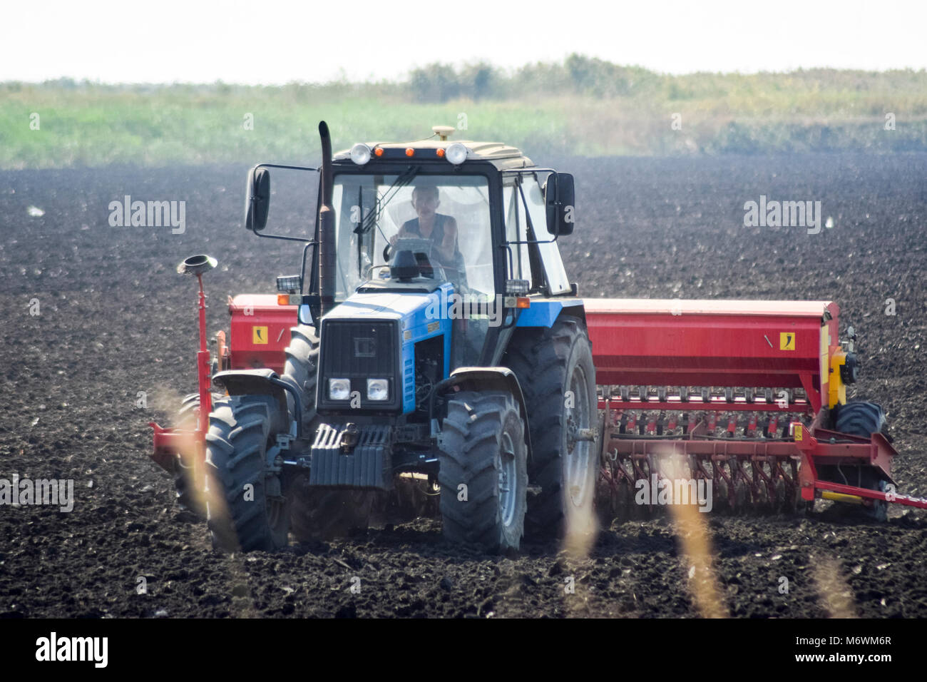 Red heavy wheeled tractor hi-res stock photography and images - Alamy