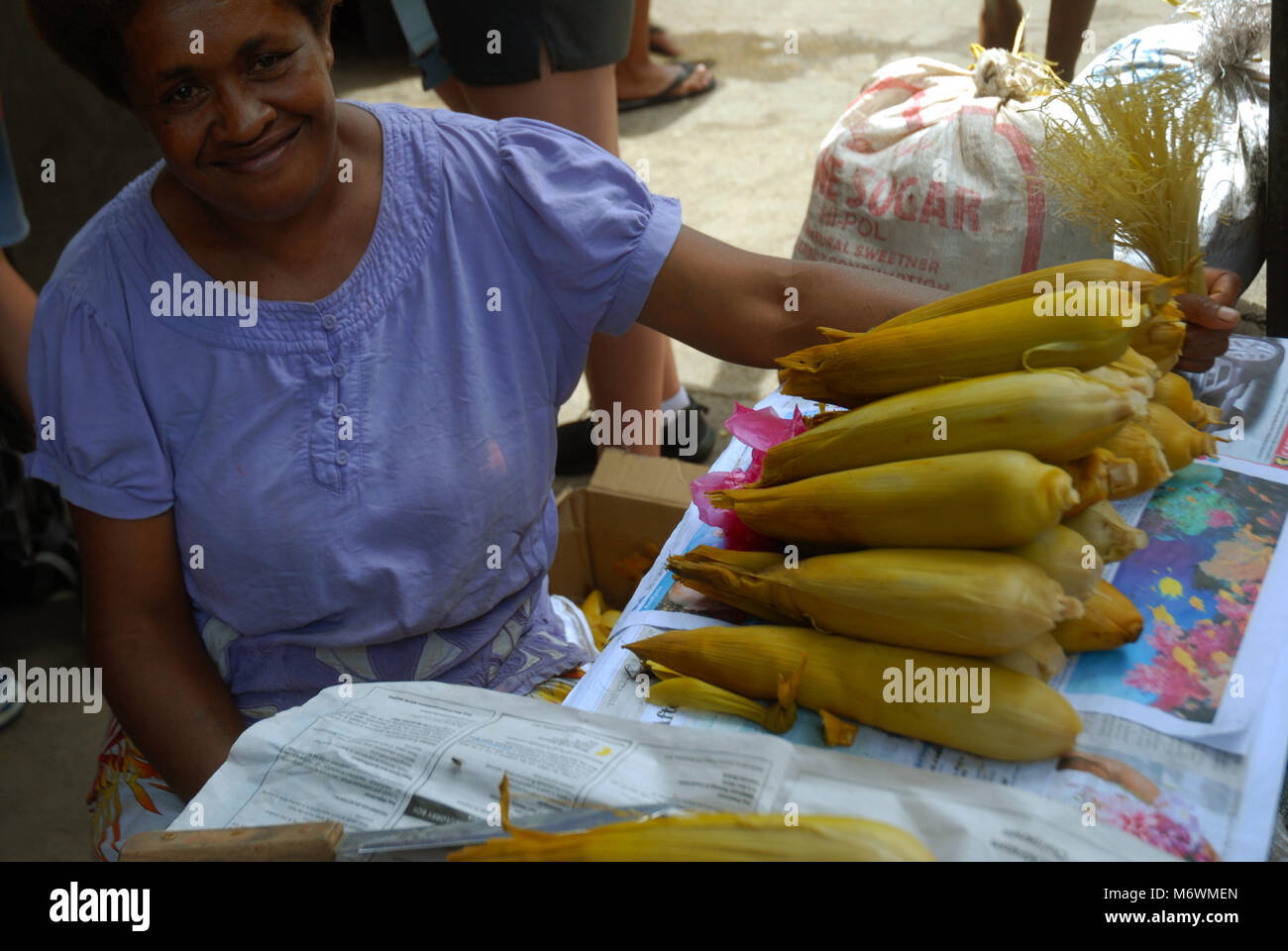 Woman selling sweetcorn at Sigatoka Market, Fiji Stock Photo - Alamy