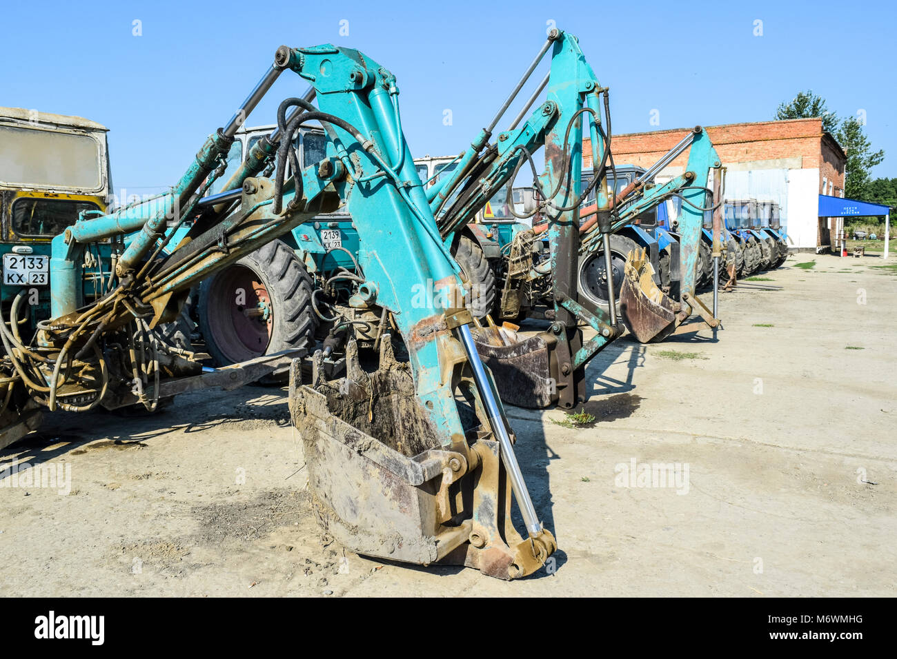 Tractor with a bucket for digging soil. Bulldozer and grader Stock ...