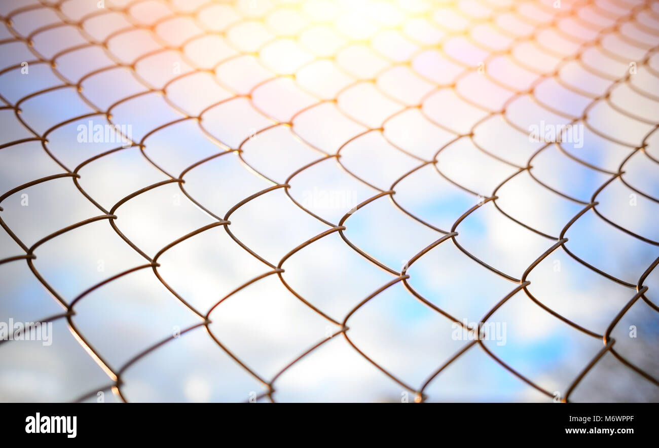 Blue sky behind a metal grate, background Stock Photo - Alamy