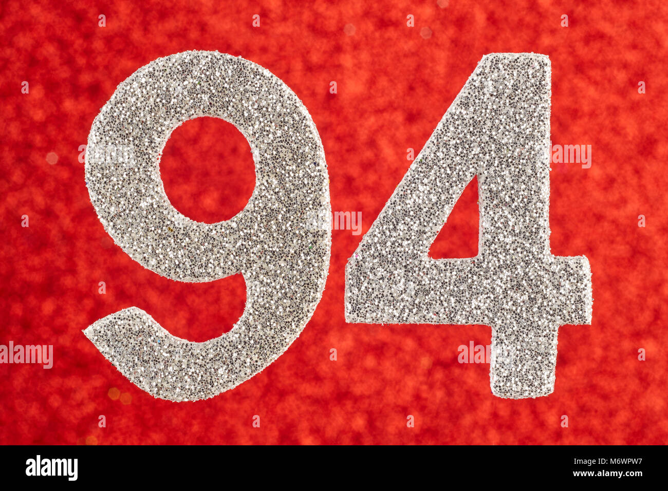 Number ninety-four silver color over a red background. Anniversary ...