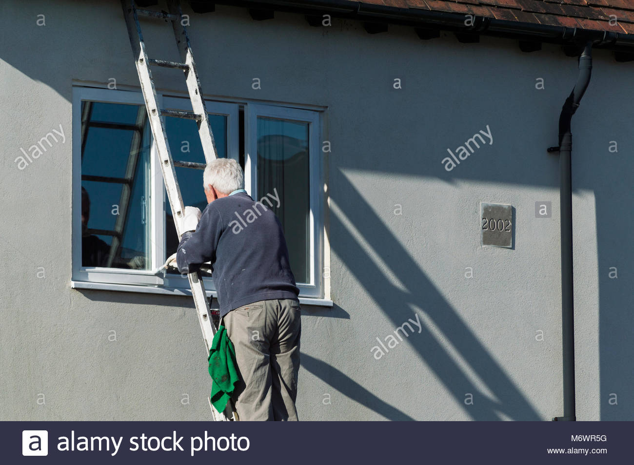 Painting House Exterior Ladder High Resolution Stock Photography and ...