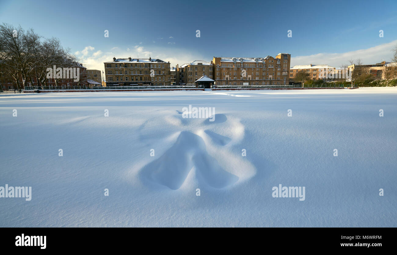 Solitary snow angel in powder snow on a bowling green in Glasgow the ...