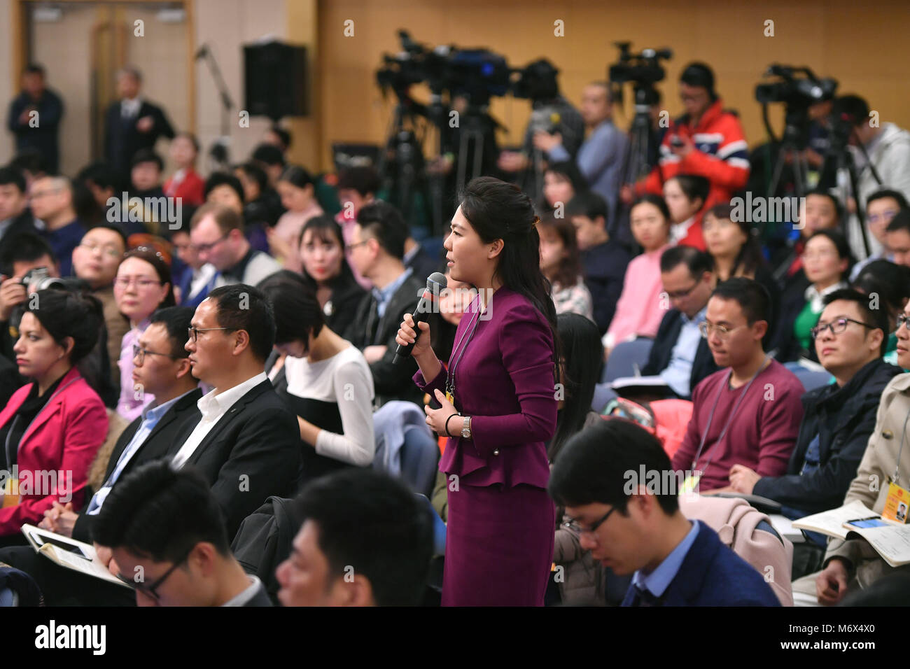 Beijing, China. 7th Mar, 2018. A journalist asks questions at a press ...
