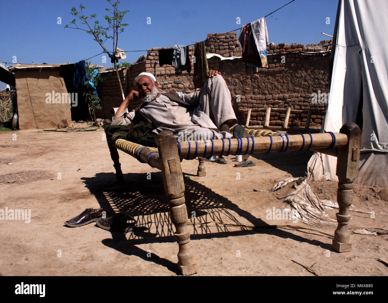 Nowshera(Pakistan. 7th Mar, 2018. An internally displaced man rests ...
