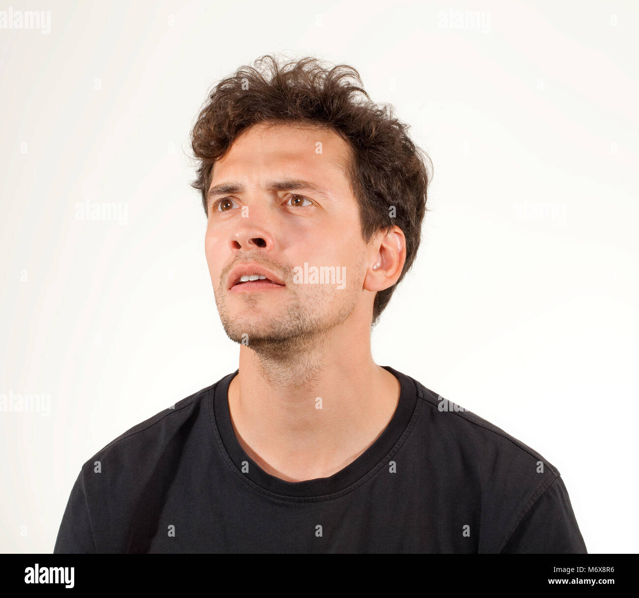 Exhausted man looking to the right Stock Photo - Alamy