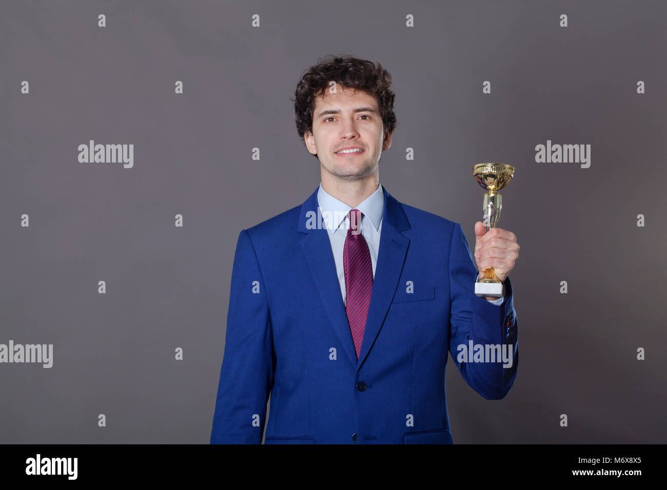 Good looking boy takes award Stock Photo - Alamy