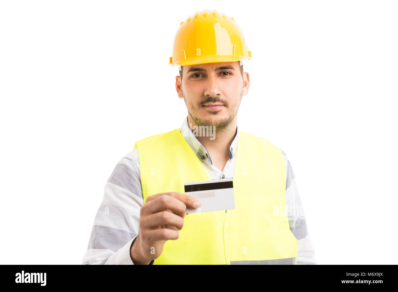 Professional engineer or constructor holding and showing credit card as ...
