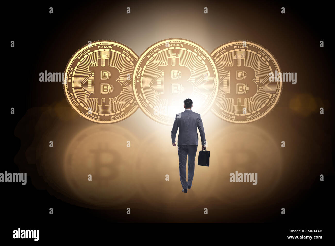 Businessman walking towards bitcoins in cryptocurrency blockchain ...