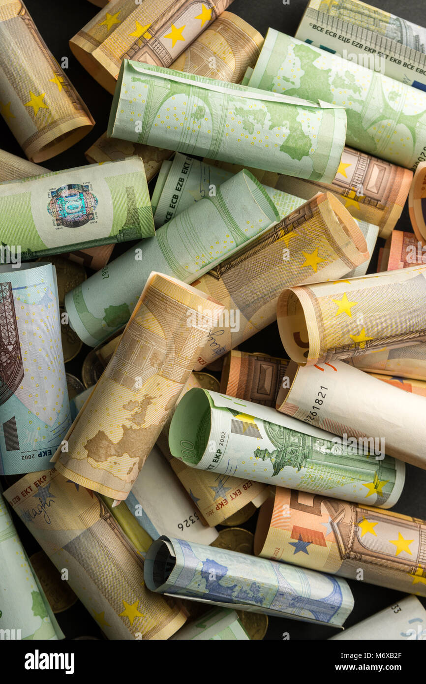 Money euro coins and banknotes in rolls Stock Photo - Alamy