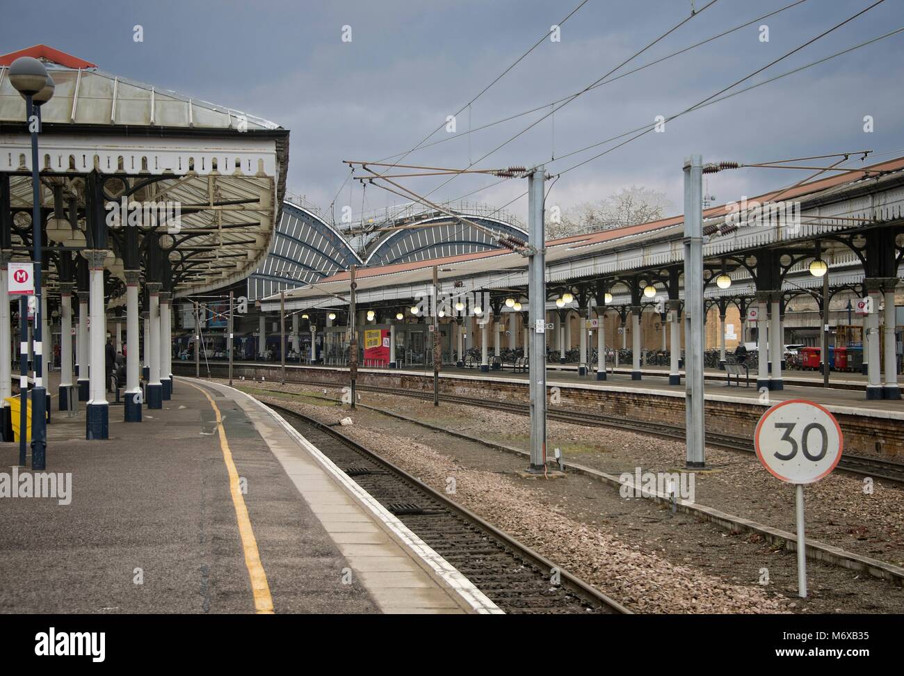 Railway station platform in fading light with an ornate Victorian ...