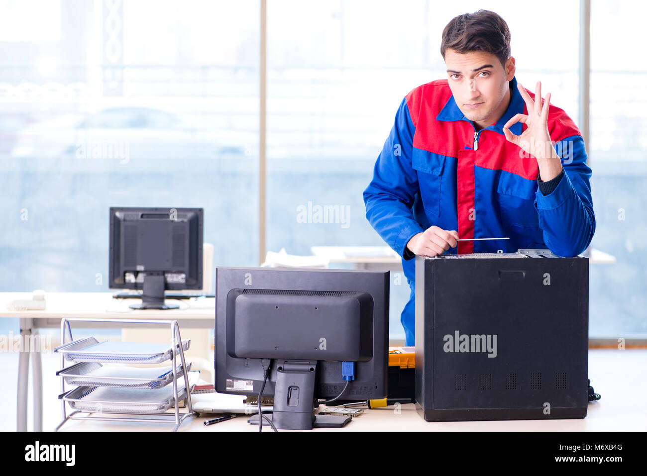 Computer repairman specialist repairing computer desktop Stock Photo ...