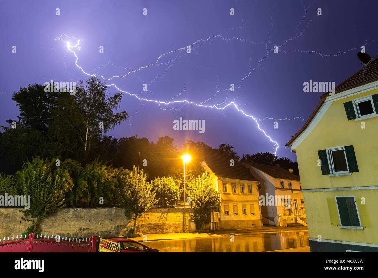 Thunderstorm lightning over houses hi-res stock photography and images ...