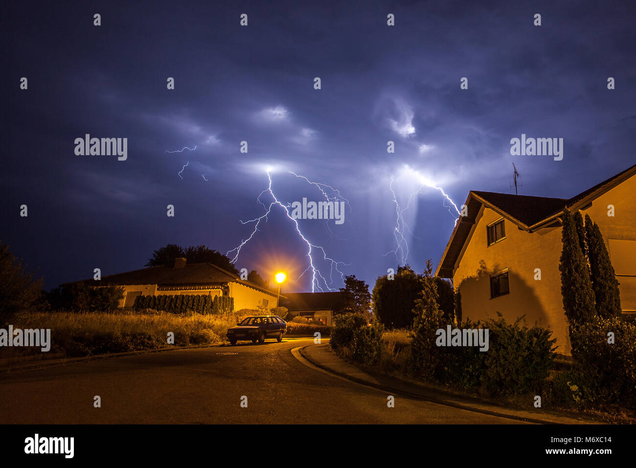 Thunderstorm lightning over houses hi-res stock photography and images ...