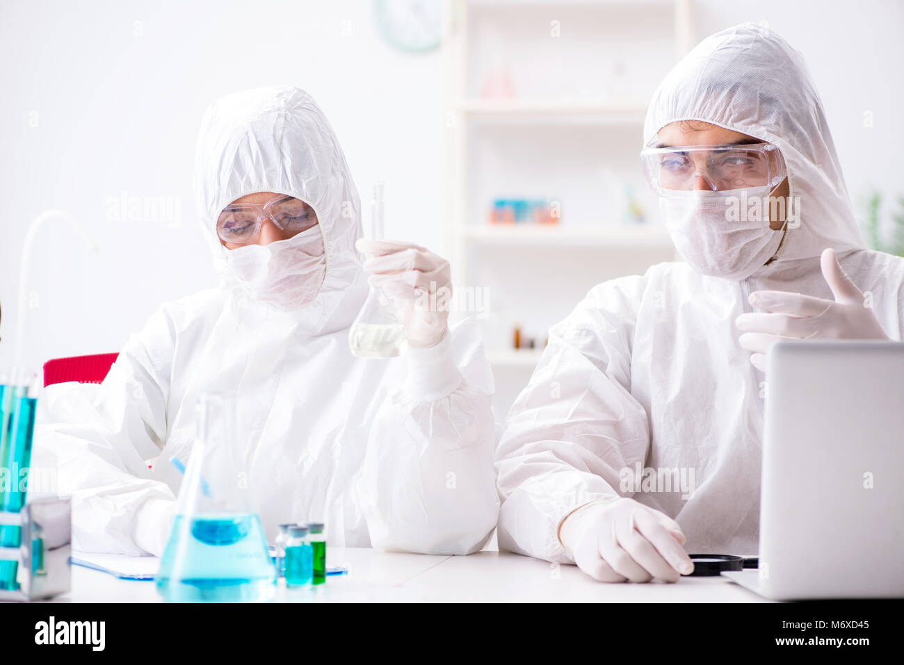 Two chemists working in the lab Stock Photo - Alamy