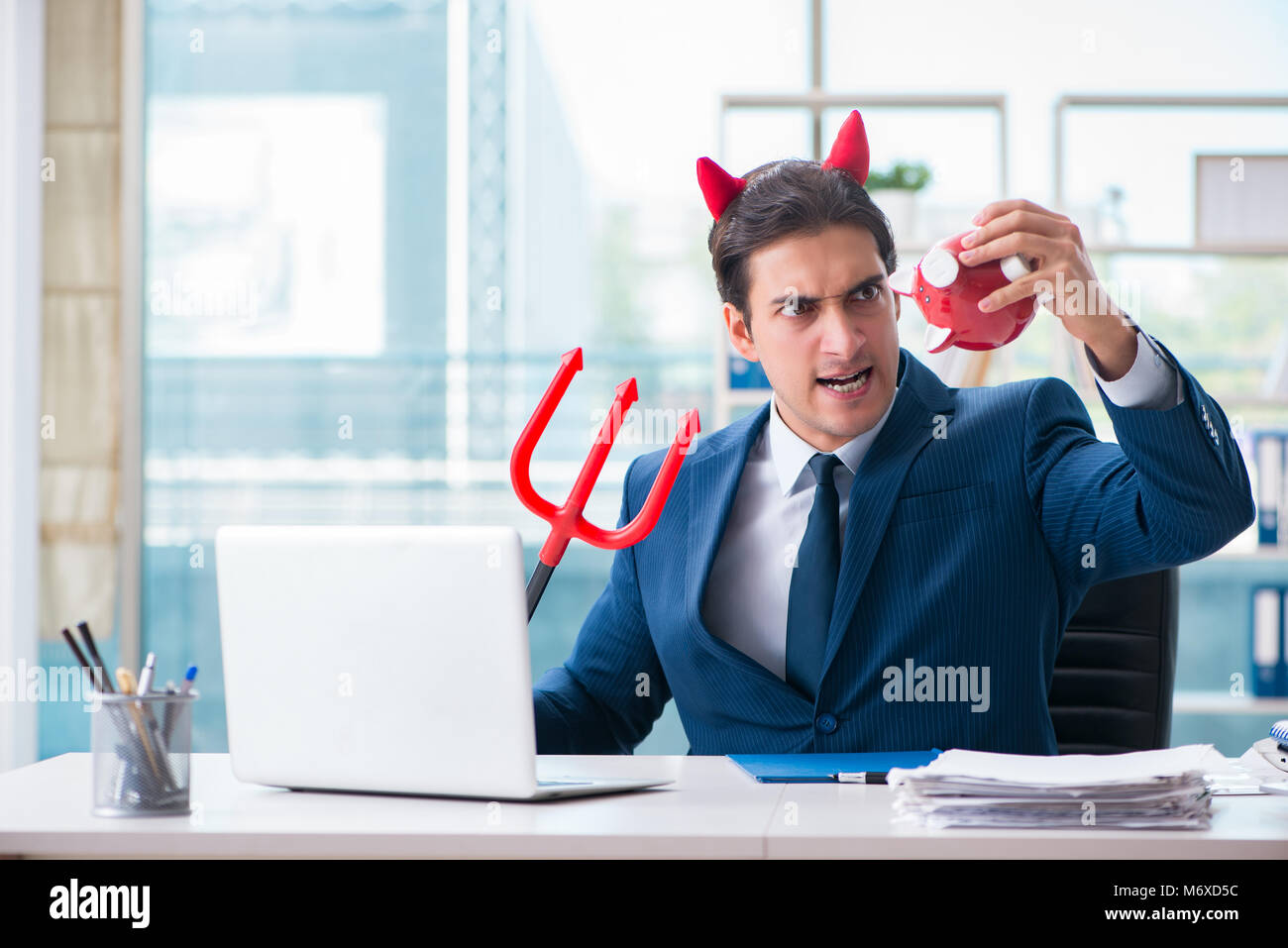 Devil angry businessman in the office Stock Photo - Alamy