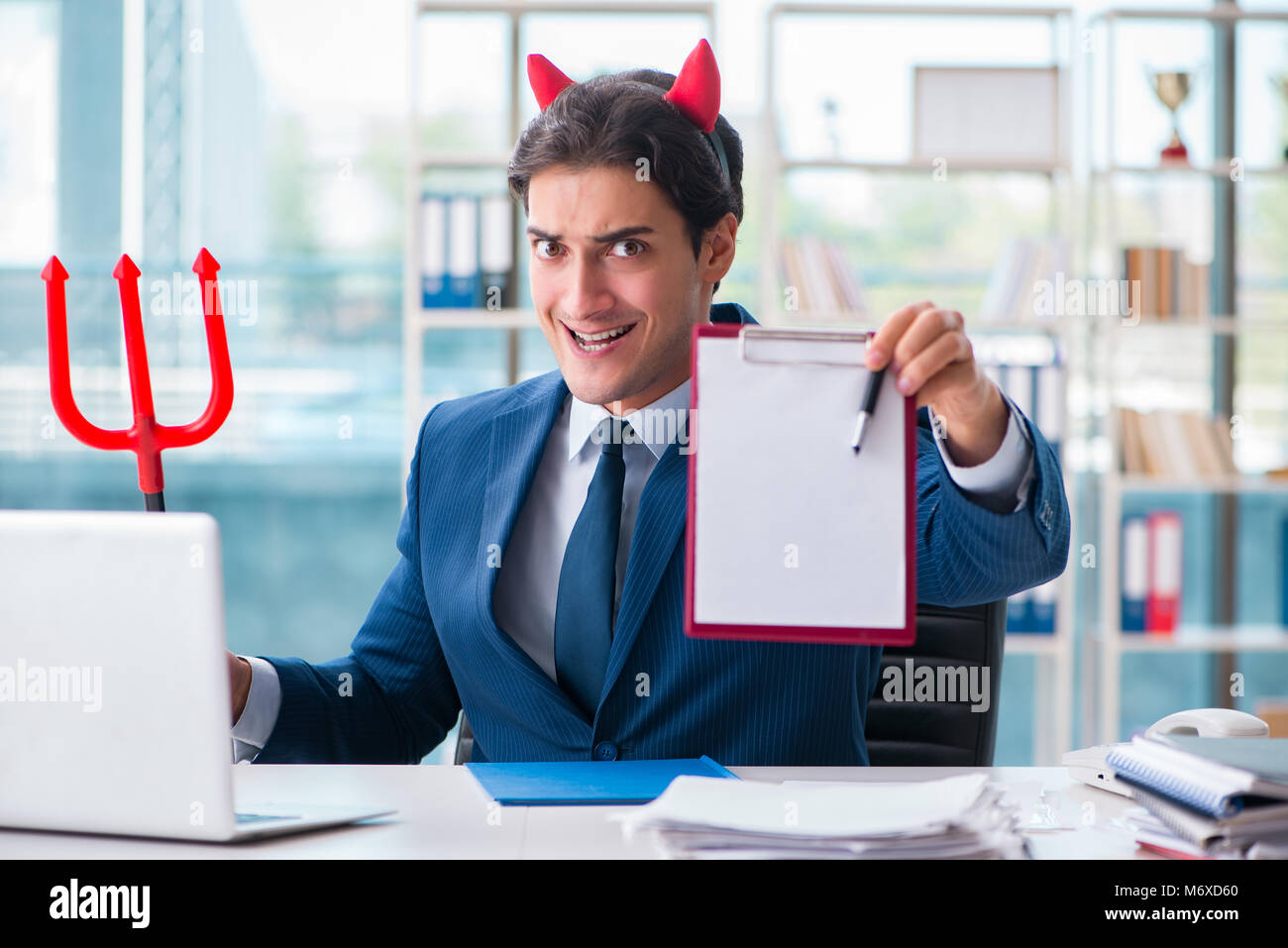 Devil angry businessman in the office Stock Photo - Alamy