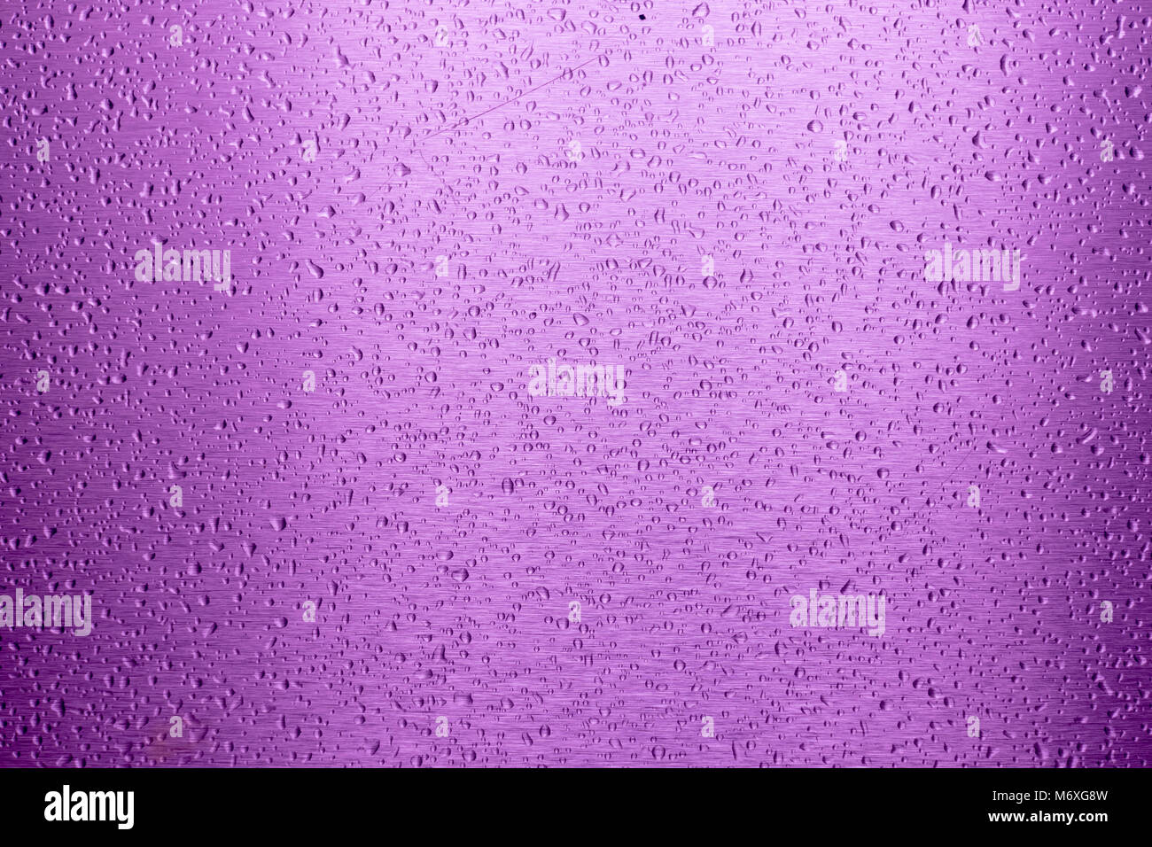 water drop on purple metal surface as background Stock Photo - Alamy