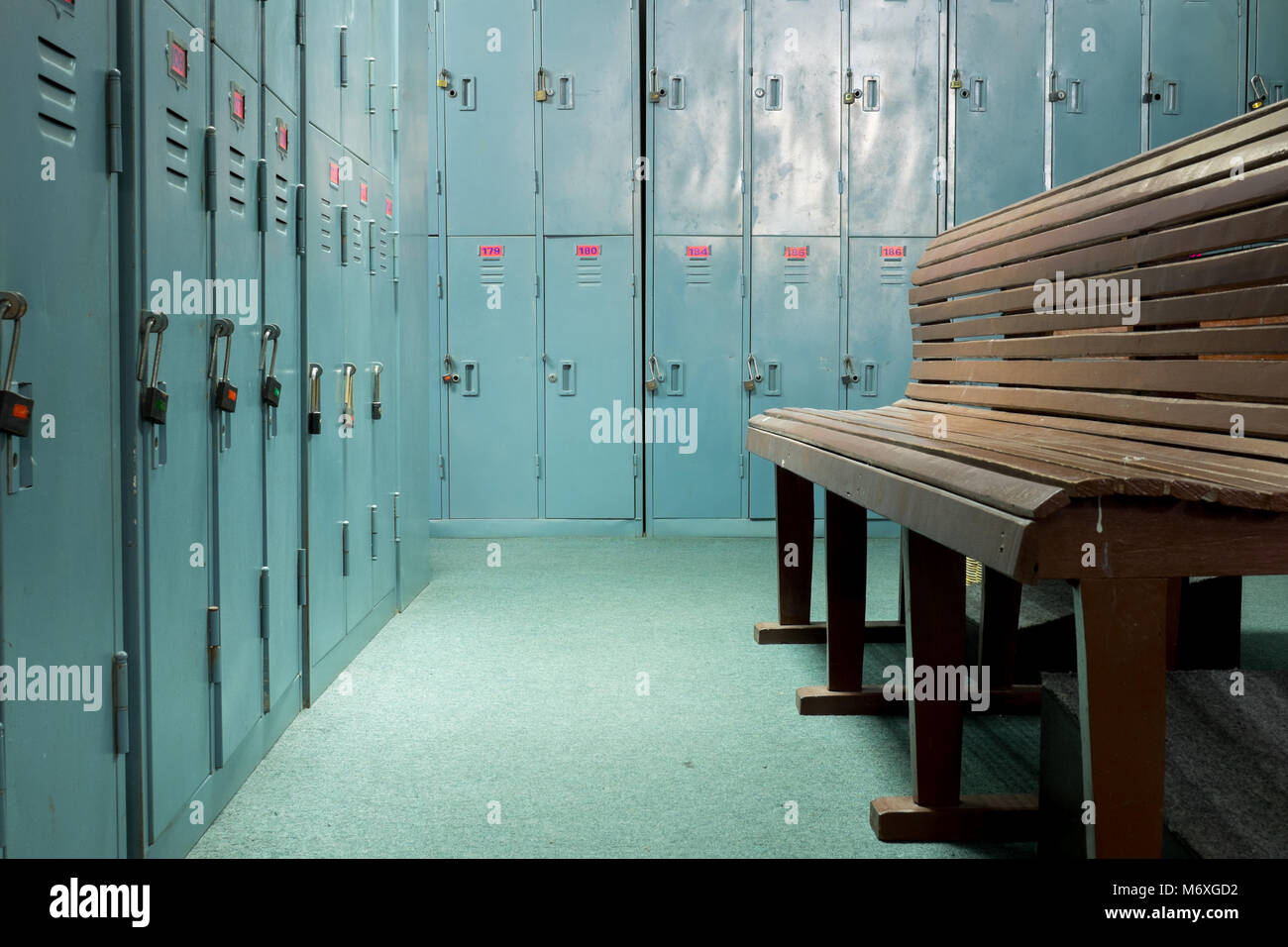 Old locer room. Old steel cabinet and wooden bench Stock Photo - Alamy