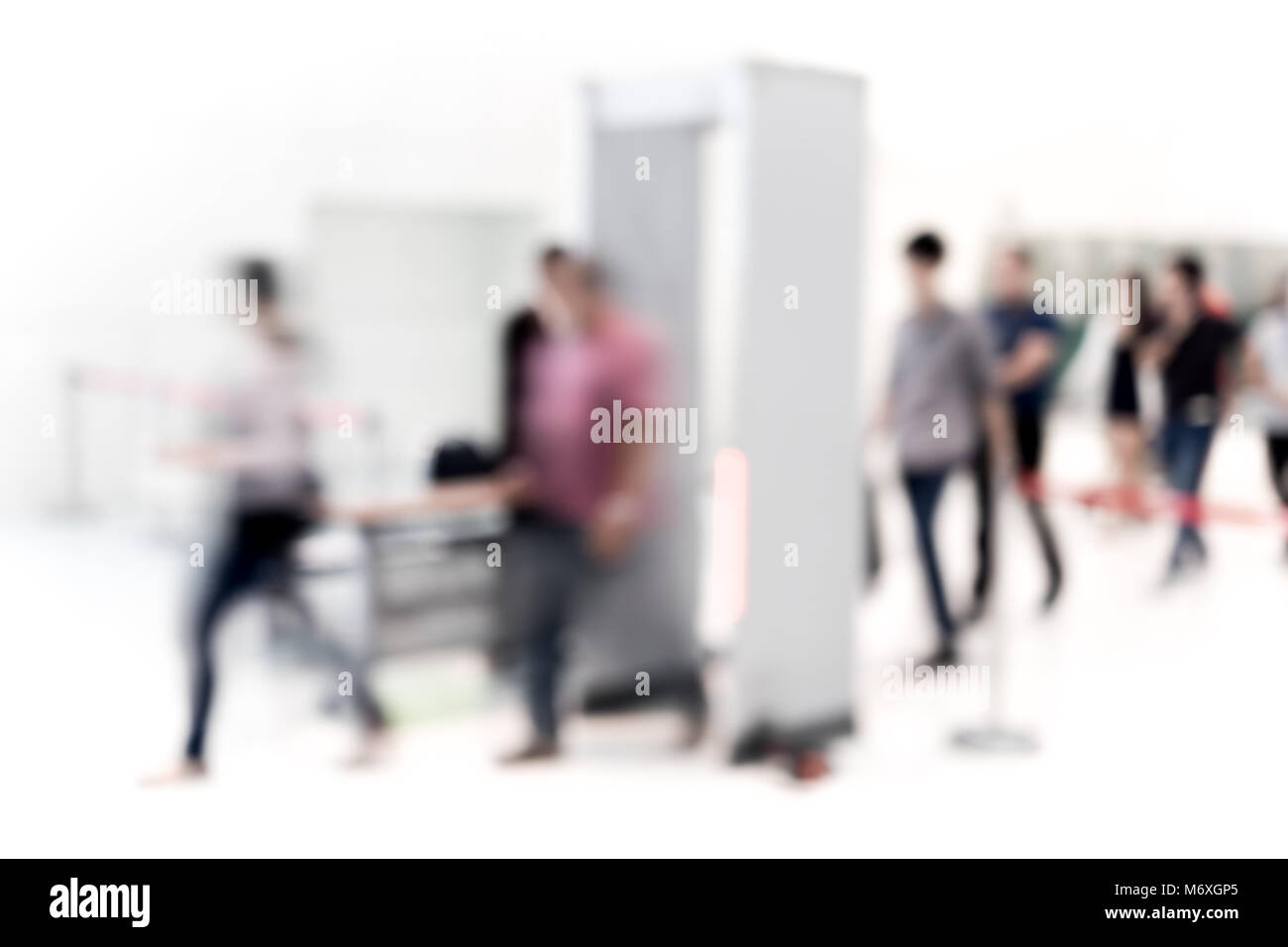 Abstract blur people walking through security gate entering building ...
