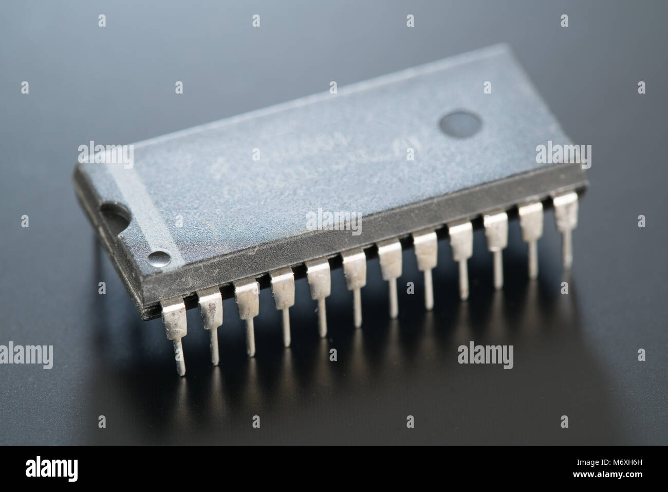 Electronic chip isolated on dark blue Stock Photo - Alamy