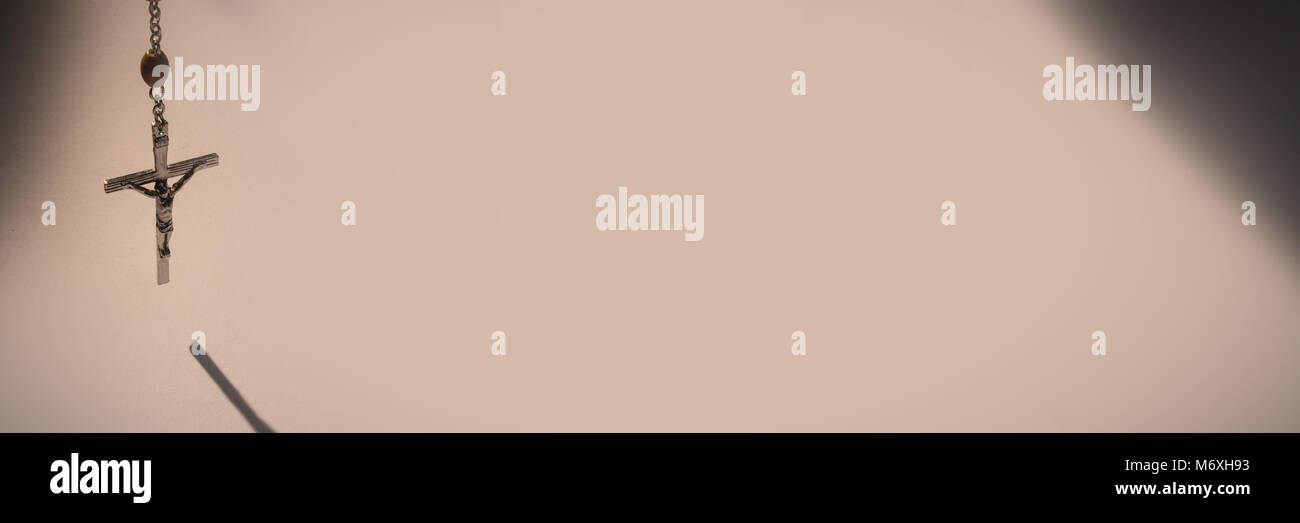 Crucifix casting a shadow Stock Photo - Alamy