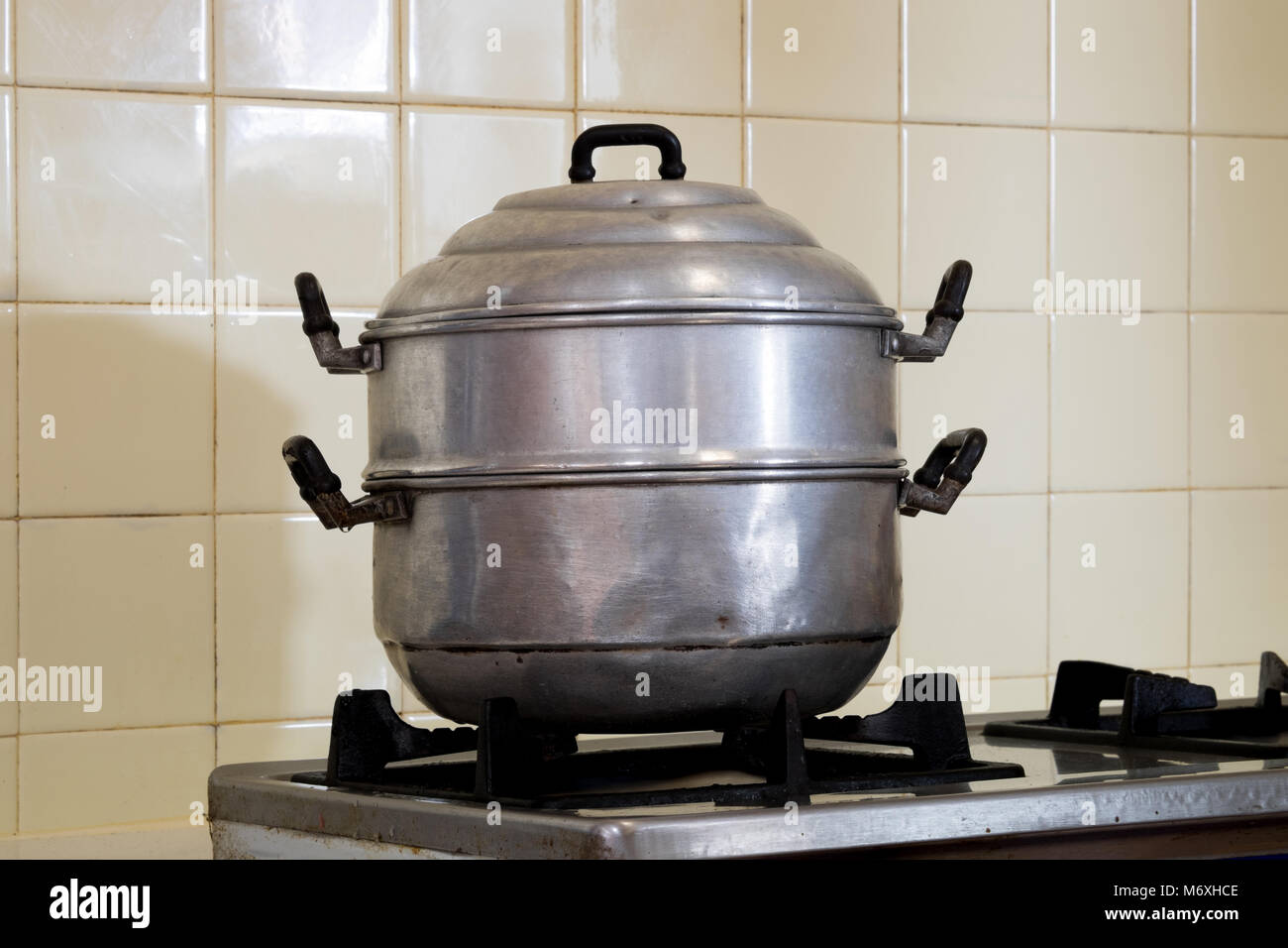 Old steamer pot on the stove in the kitchen Stock Photo - Alamy