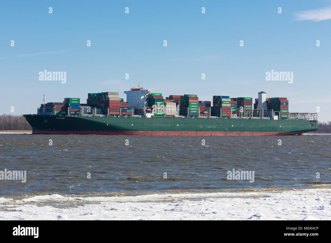 Container ship TITAN on Elbe river. It is 369 meters long and, owned by ...