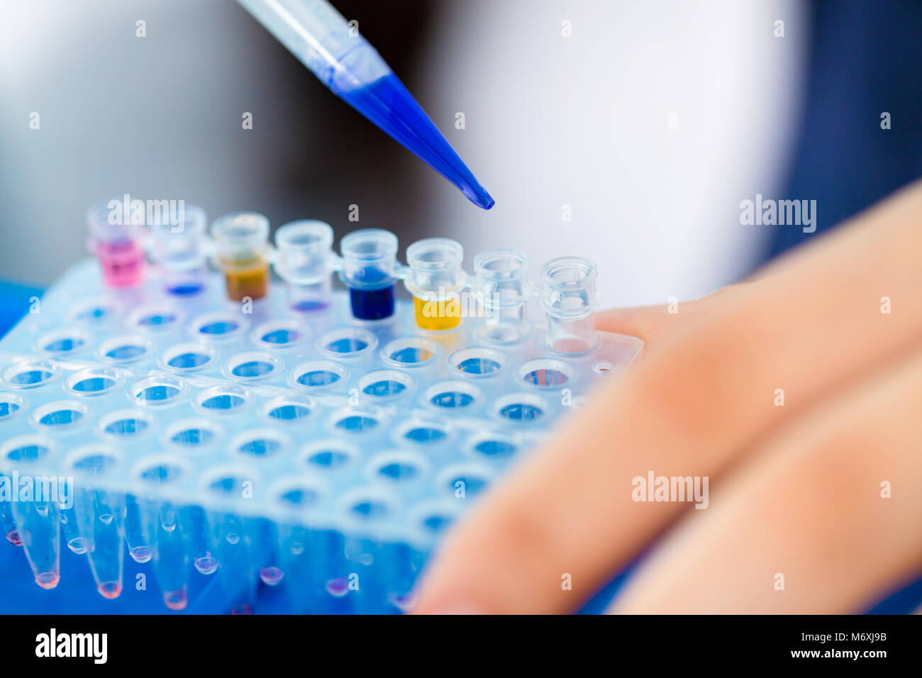 Young female technician in genetic laboratory with PCR Stock Photo - Alamy