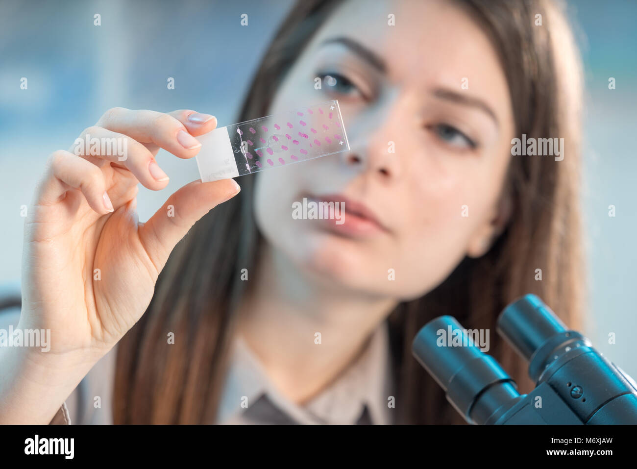 Girl with a slide for the microscope University Hospital Stock Photo ...