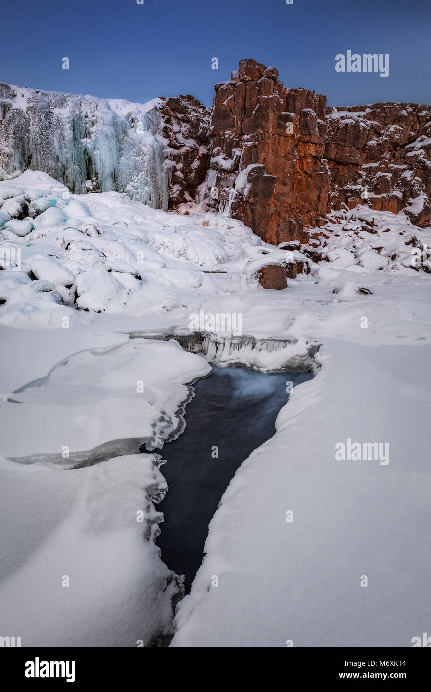 Frozen Oxararfoss Waterfall, Thingvellir National Park, Iceland. Unesco ...