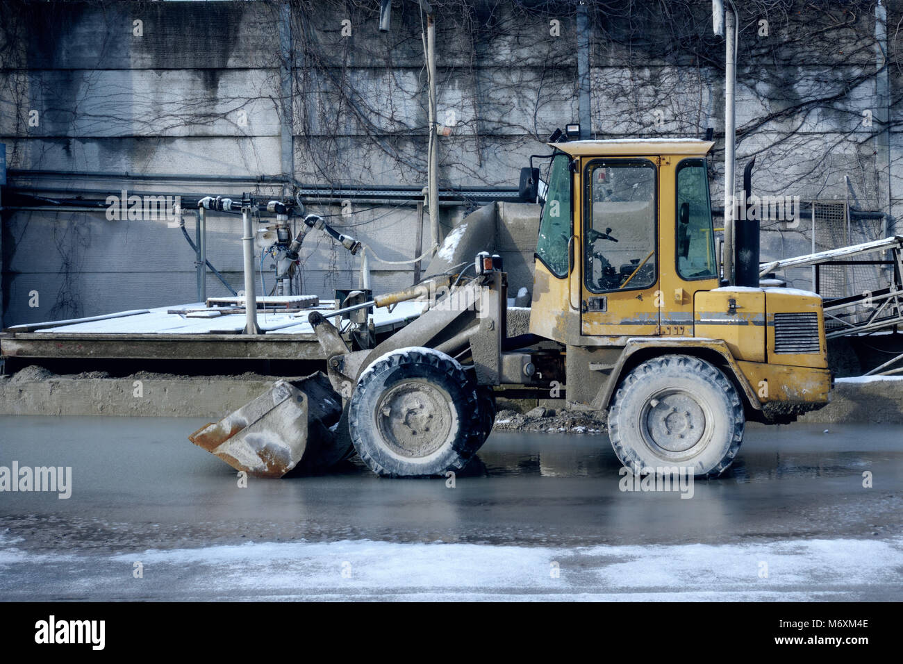 a digger in freezing cold Stock Photo - Alamy