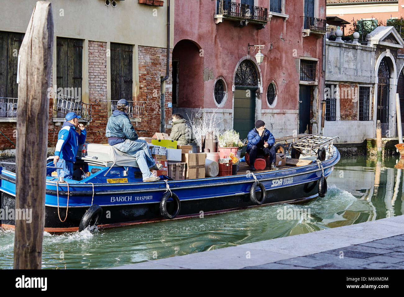 scenes of a smaller canal in venice, italy showing more domestic scenes ...