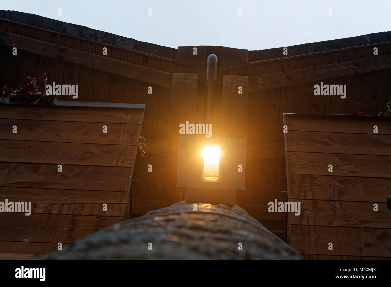 Light lamp under the wooden roof, with dark wooden beams Stock Photo ...