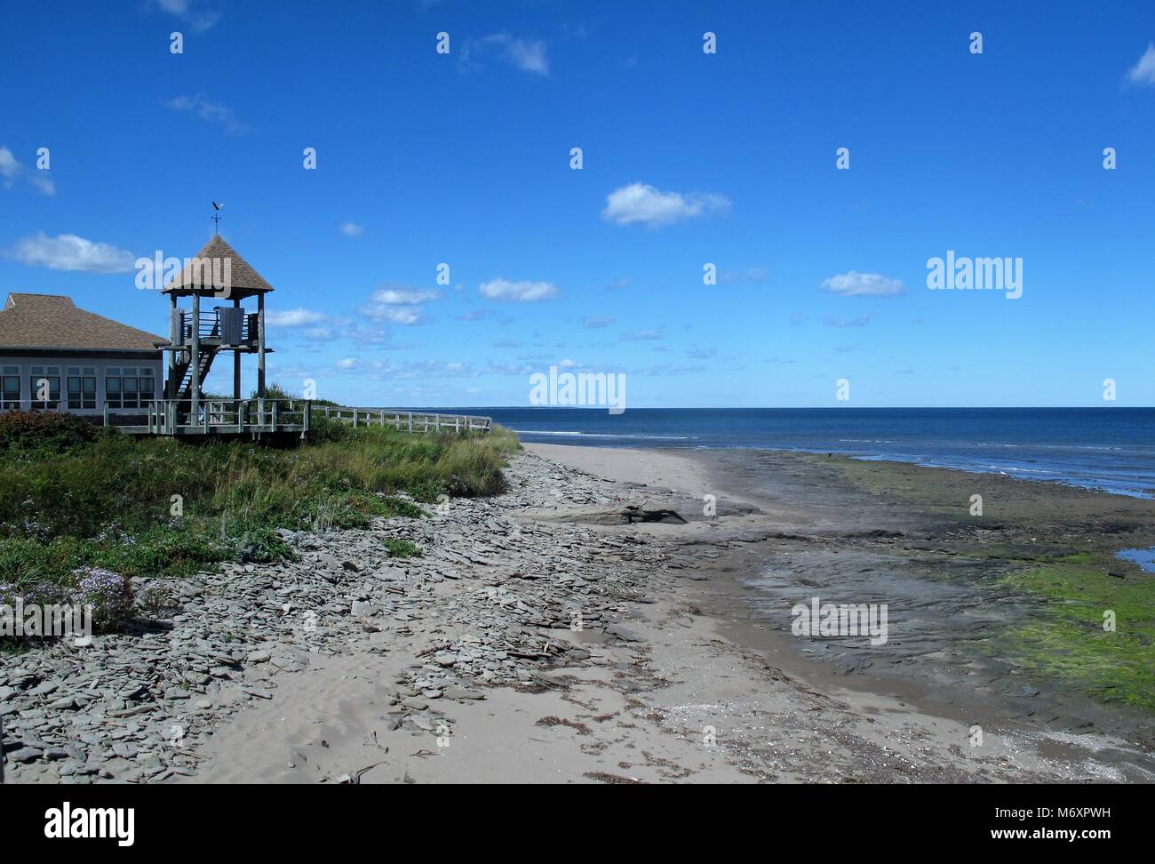 Wooden lookout tower on a rocky beach by the ocean Stock Photo - Alamy