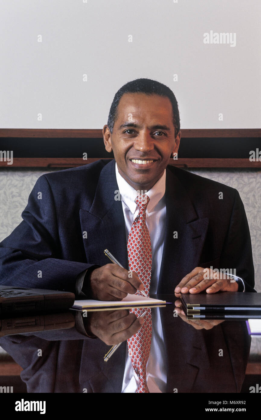 2000 HISTORICAL AFRICAN AMERICAN BUSINESSMAN SEATED WITH PEN AND PAPER ...
