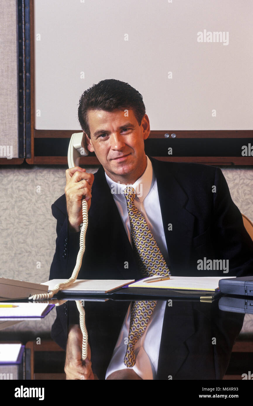 2000 HISTORICAL CAUCASIAN BUSINESSMAN SEATED HOLDING LANDLINE TELEPHONE ...