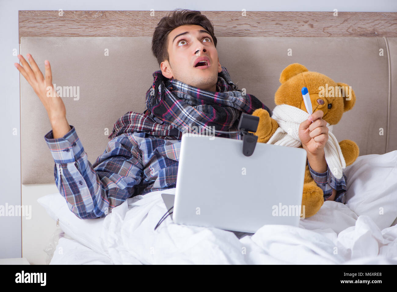 Sick man suffering from flu in the bed Stock Photo - Alamy