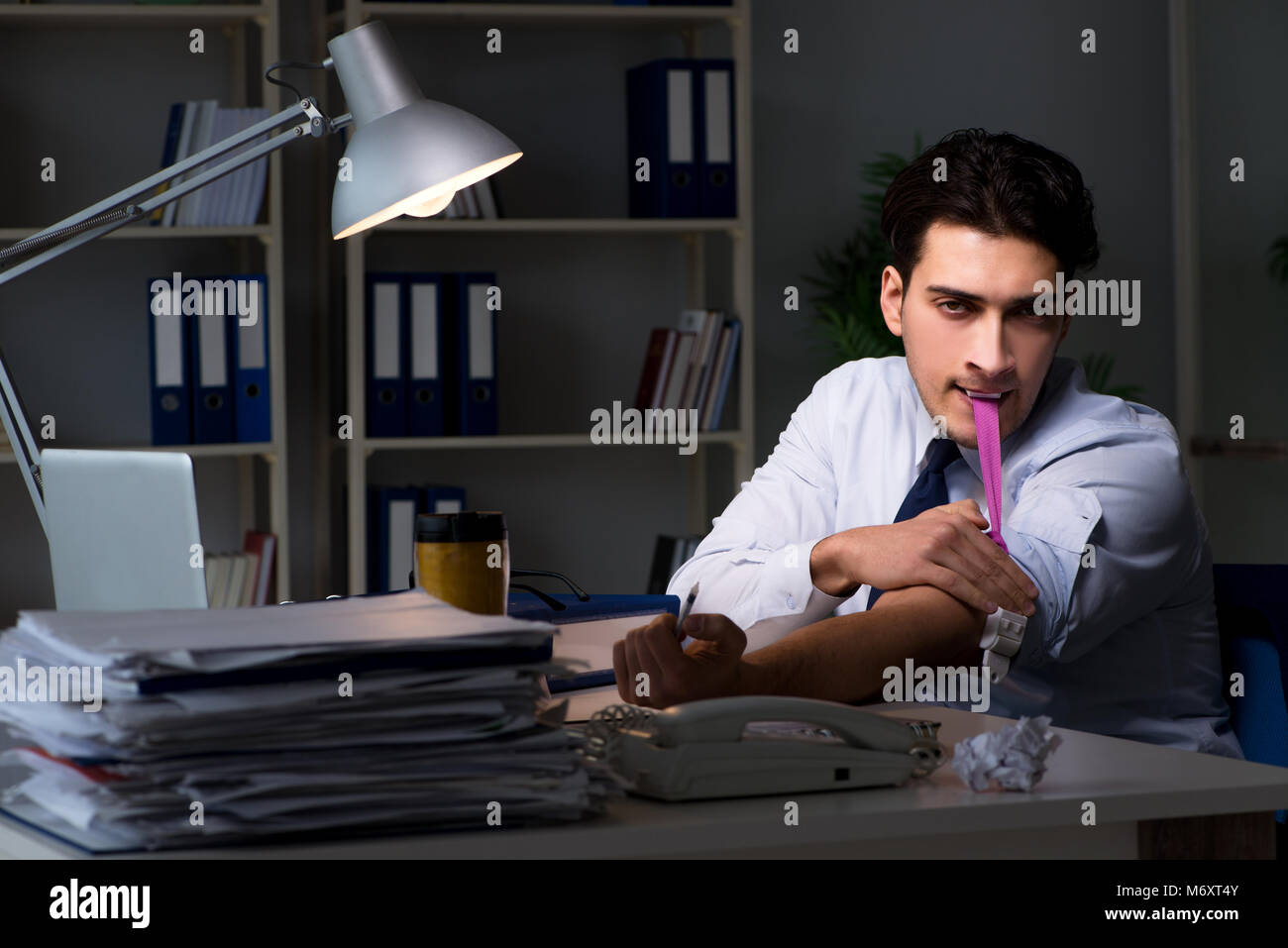 Employee relieving stress from overtime with drugs narcotics Stock ...