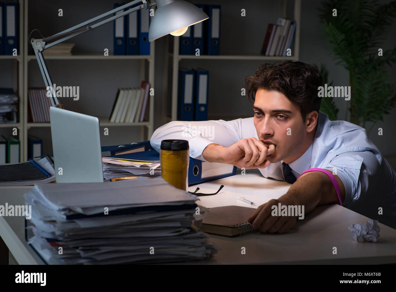 Employee relieving stress from overtime with drugs narcotics Stock ...